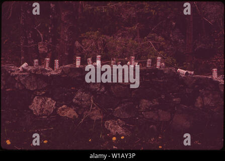 BEER CANS WERE TARGETS ON THIS STONE WALL Stock Photo - Alamy