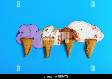 top view multiple flavor ice cream cones melted close up on yellow ...