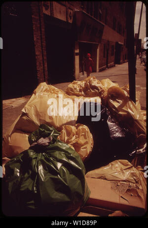 GARBAGE IS PILED HIGH ON THE SIDEWALK OUTSIDE NEW YORK MEDICAL CENTER ...