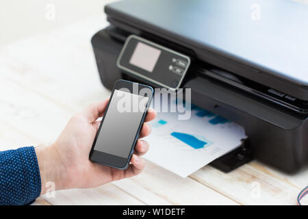 Man's hand making copies. Working with printer Stock Photo - Alamy
