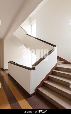 Interior design of apartment building stairwell area with steps and ...