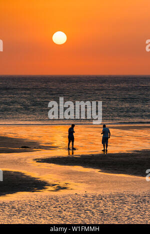 A beautiful golden light over Fistral Bay in Newquay in Cornwall Stock ...