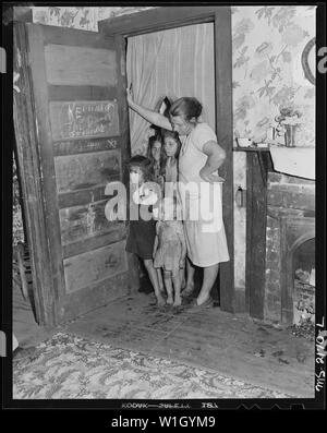 Mrs. Ceph Holland, wife of a miner, with four of her six children in ...