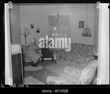 Mrs. Jessie Manchester, wife of a miner, is pictured in her company ...