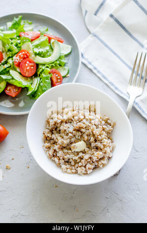 hot Buckwheat porridge with melting butter in plate andHealthy ...