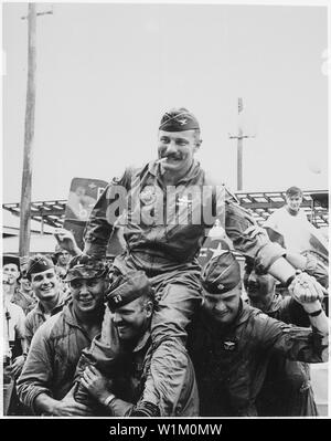 Vietnam War. Colonel Robin Olds (1922-2007) and pilots celebrate the ...