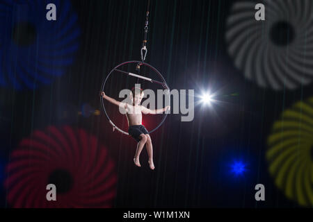 Little boy circus artist on stage. Circus kids. Performs child acrobat ...