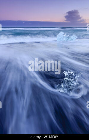 Blocks of ice from the Jokulsarlon glacial lagoon washed up on Diamond ...