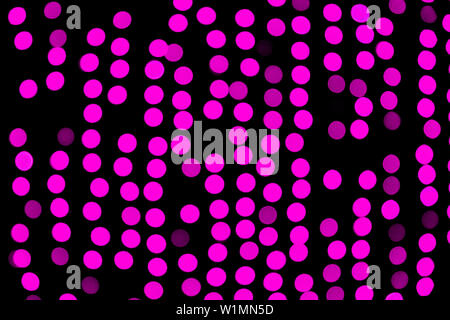 Unfocused abstract purple bokeh on black background. defocused and ...