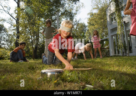 Children playing Hit the Pot, children's birthday party Stock Photo - Alamy