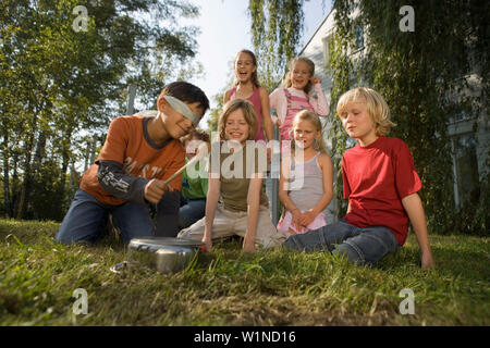 Children playing Hit the Pot, children's birthday party Stock Photo - Alamy