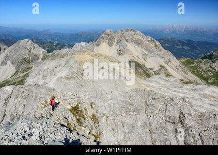 Woman hiking descending from Grosses Mosermandl, Faulkogel in ...