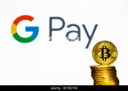 Gold Bitcoin coins with the Google logo on background screen Stock ...