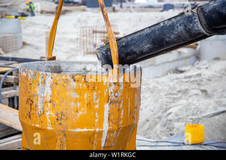 Concrete bucket for pouring concrete. Concrete funnel skip for aiming ...