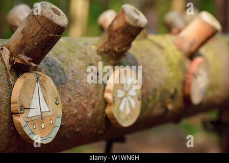 Rustic wardrobe with coat hooks and colorful simple name tags in the ...