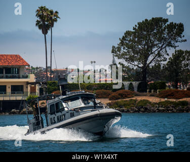 A SeaArk 34-foot Dauntless patrol boat provides security for a U.S ...