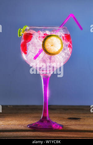 Closeup shot of gin tonic rose with raspberries and lime Stock Photo ...