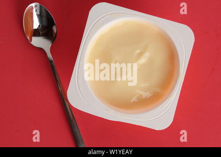 custard packed in plastic container Stock Photo - Alamy