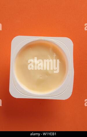 custard packed in plastic container Stock Photo - Alamy