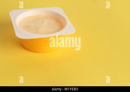 custard packed in plastic container Stock Photo - Alamy
