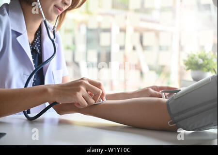 Closeup shot of a doctor with a sphygmomanometer Stock Photo - Alamy