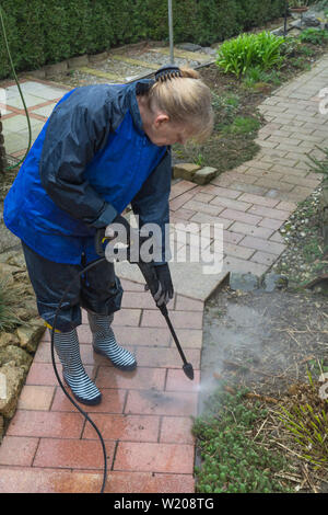 Cleaning stone slabs with the high-pressure cleaner Stock Photo - Alamy