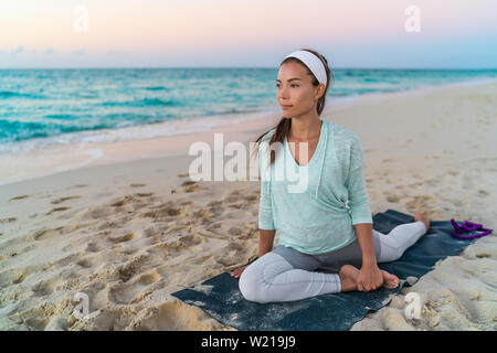 Woman stretching her groin Stock Photo - Alamy