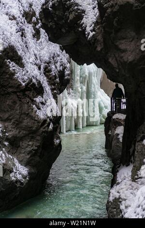 Germany, Bavaria, Garmisch Partenkirchen, Young couple stand up padling ...