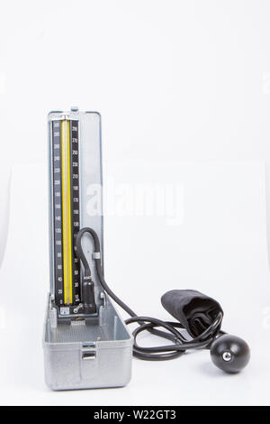 Blood pressure measurement. Paramedic at a general practice (GP) clinic ...