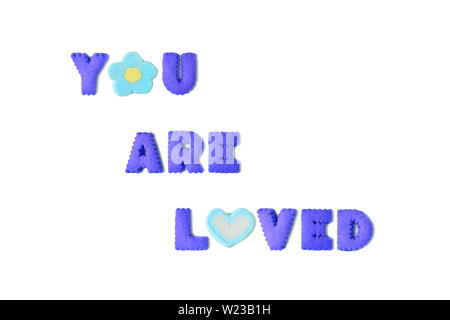 The word LOVE spelled with blue alphabet cookies and cyan marshmallow ...