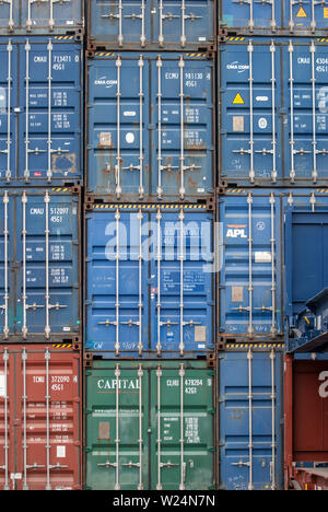 Piles of containers at commercial transit station Stock Photo - Alamy