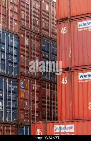 Piles of containers at commercial transit station Stock Photo - Alamy