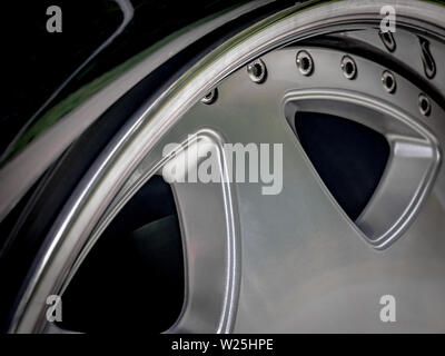 alloy wheel close up. silver metallic color on black background Stock ...