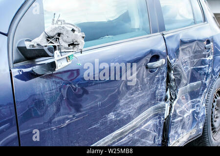 Crashed car, detail on side - metal plates deformed after accident hit ...