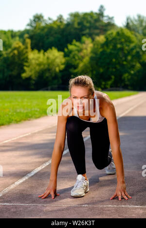 Focus and strength. An attractive young woman in a yoga position Stock ...