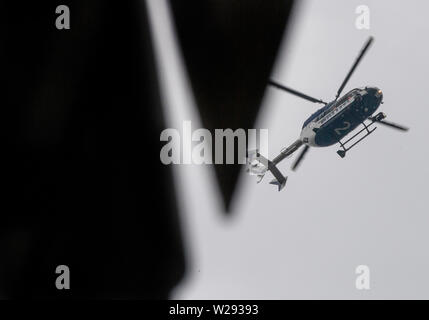 Police helicopter with a thermal imaging camera for the search of hot ...