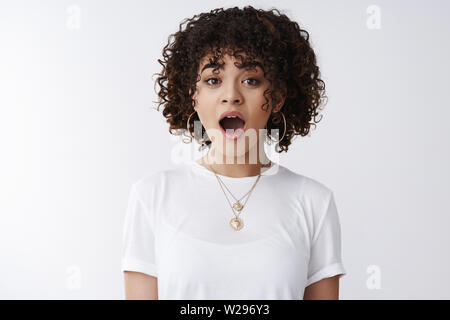 Shocked speechless impressed curly-haired silly girl drop jaw gasping ...
