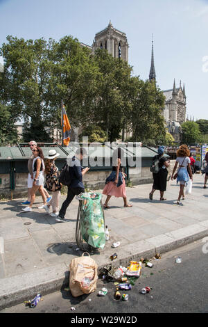 full trash can in Paris, Montmartre Stock Photo - Alamy