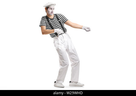 Pantomime man pulling a rope isolated on white background Stock Photo ...