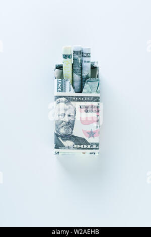 Package of cigarette filled with paper money dollars banknote and ...