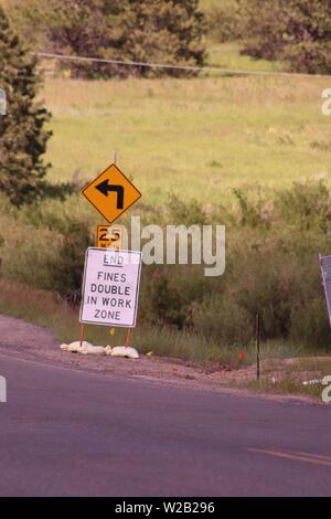 Speed fines double in work area sign Stock Photo - Alamy