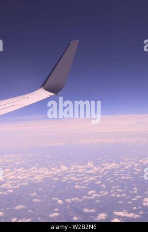 A right wing of Boeing 737-800 jet plane during flight on high altitude ...