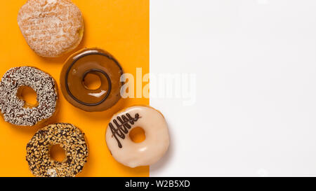 Doughnut with split color yellow and white background, close up food ...