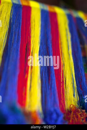 Colorful threads on a loom for traditional Panja dhurrie weaving ...