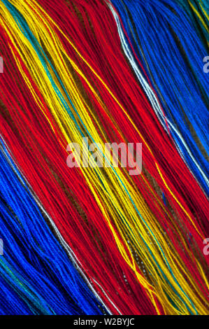 Colorful threads on a loom for traditional Panja dhurrie weaving ...