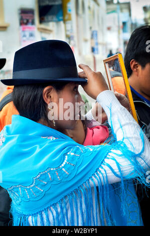 An indigenous Ecuadorian Indian woman in the traditional fedora hat and ...