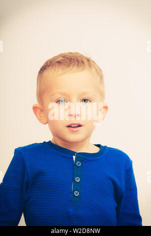 Face expressions, children concept. Portrait of happy kid boy making ...