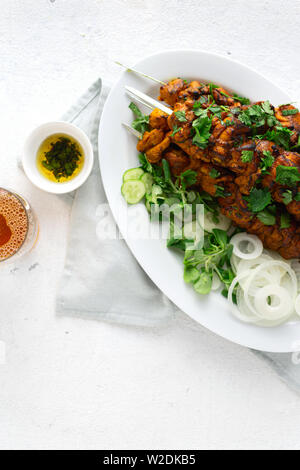 Shish kebab with beer and sauce on a wooden board top view Stock Photo ...
