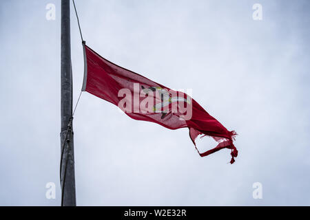 Red sign of the Triskelion the Manx emblem of three legs of man outside ...