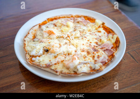 Normal pizza isolated on white Stock Photo - Alamy